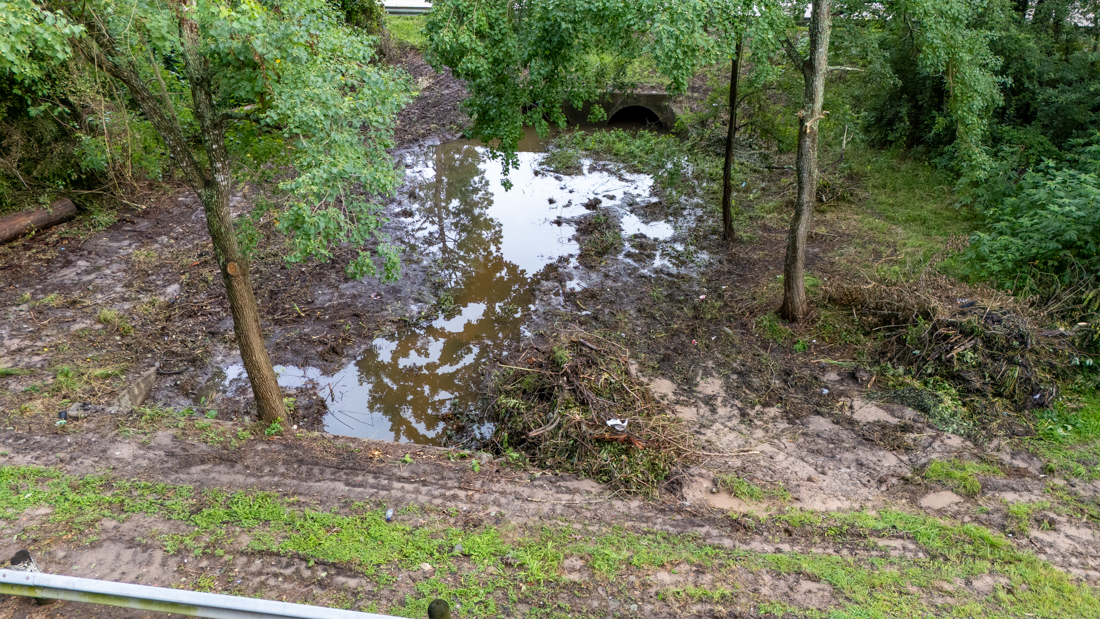 City Begins Clearing Blocked Ditch Under Kingwood Drive - Reduce Flooding